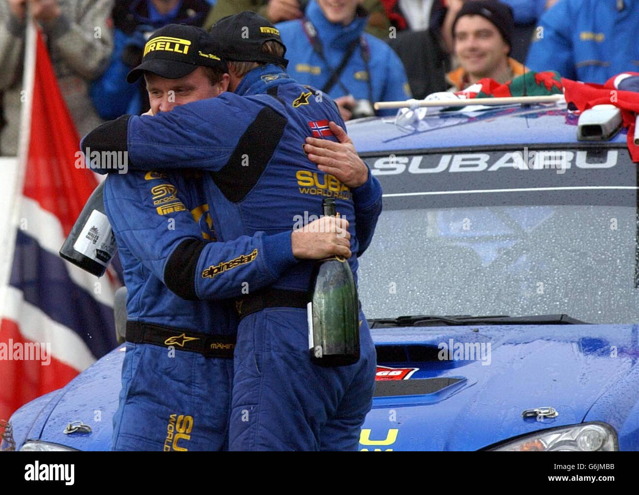 Norway's Petter Solberg (right) hugs co-driver Philip Mills, from Wales ...