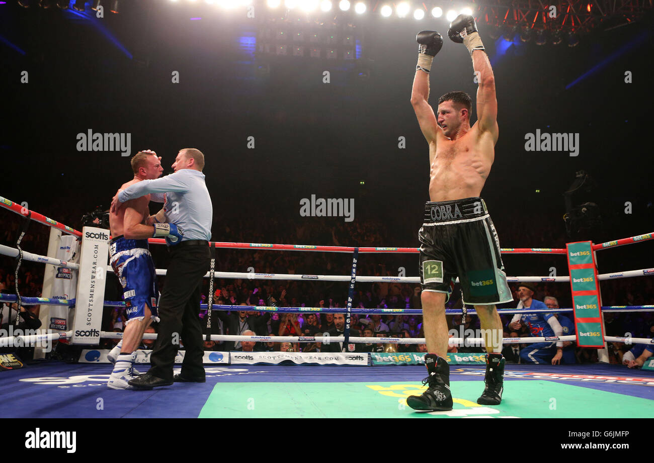Referee Howard Foster stops Carl Froch (right) and George Groves during ...