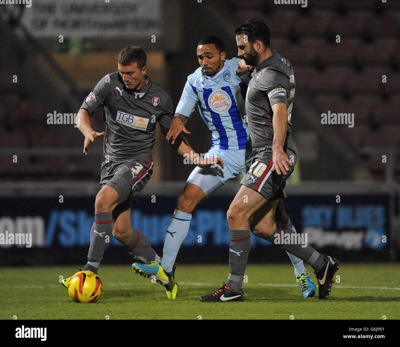 Coventry City's Callum Wilson (centre) battle for the ball against ...