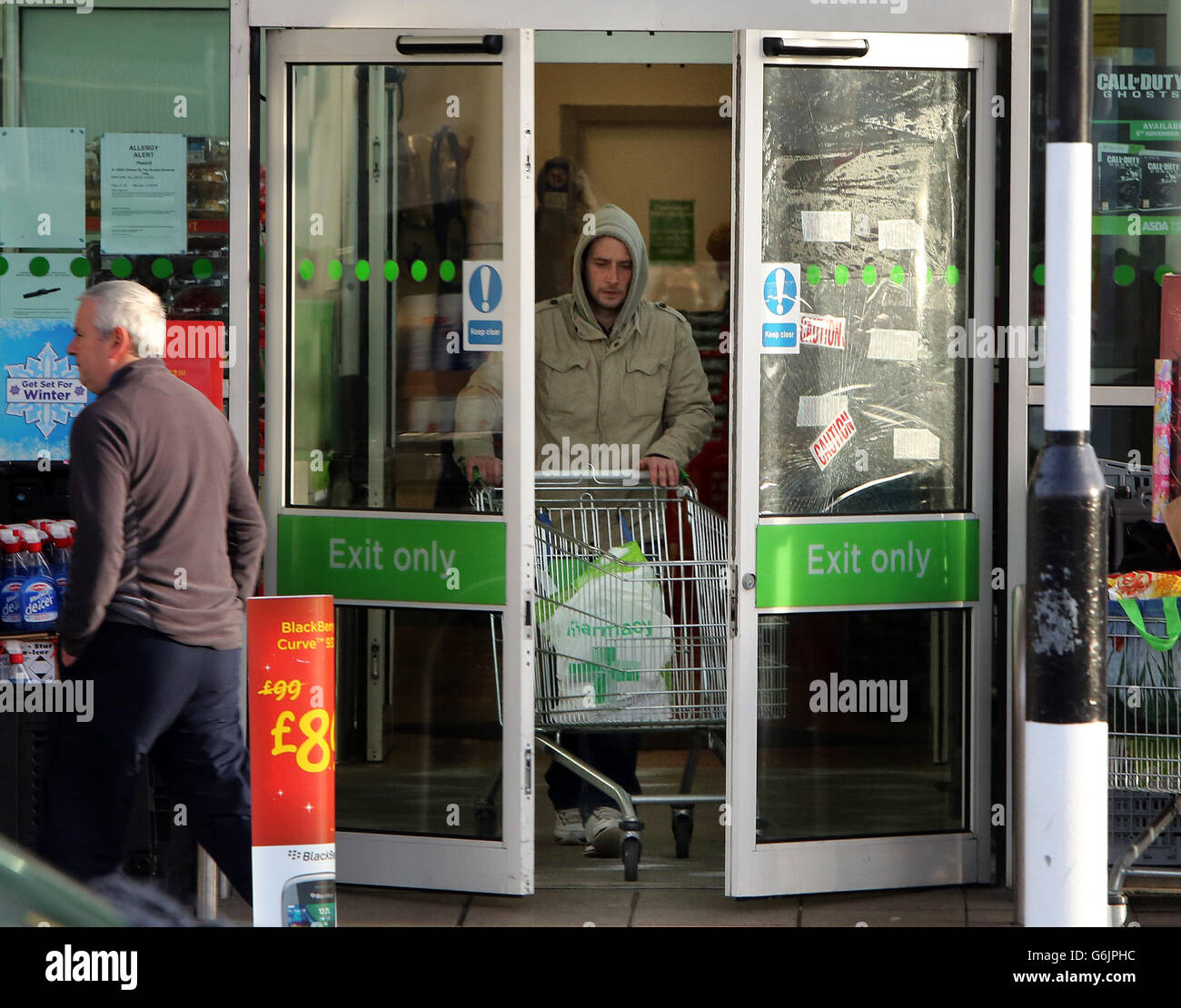 Shoppers leave the Westwood Asda store, in west Belfast where a woman ...