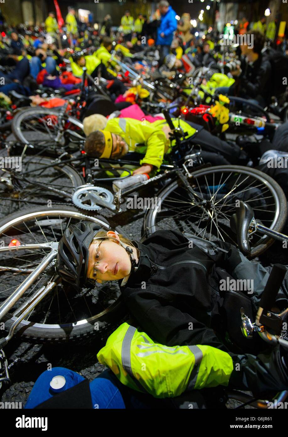 Cyclists take part in a 'die-in' protest outside the headquarters of ...