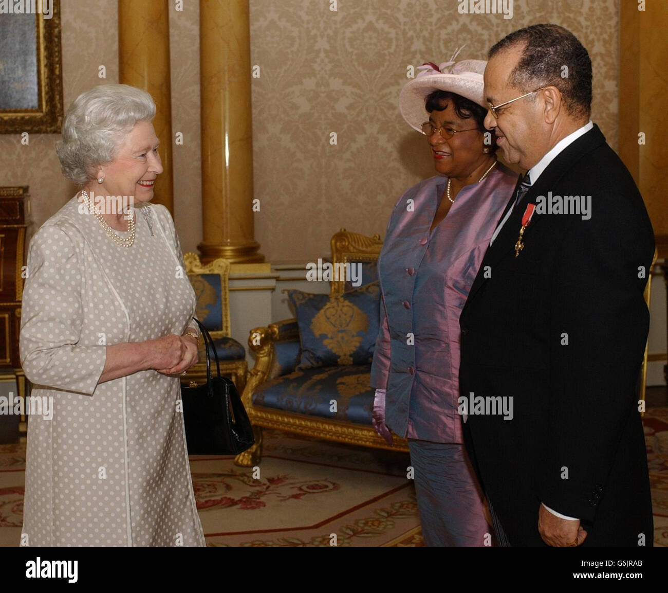 Britain's Queen Elizabeth II receives His Excellency Mr Edwin Pollard ...