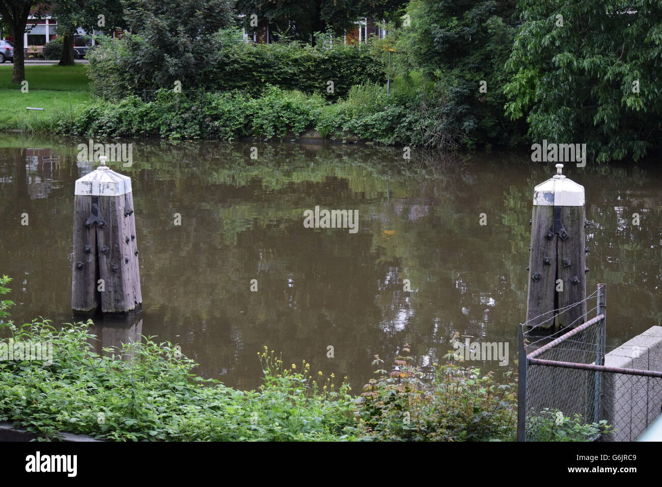 mooring pillars along the river Stock Photo - Alamy