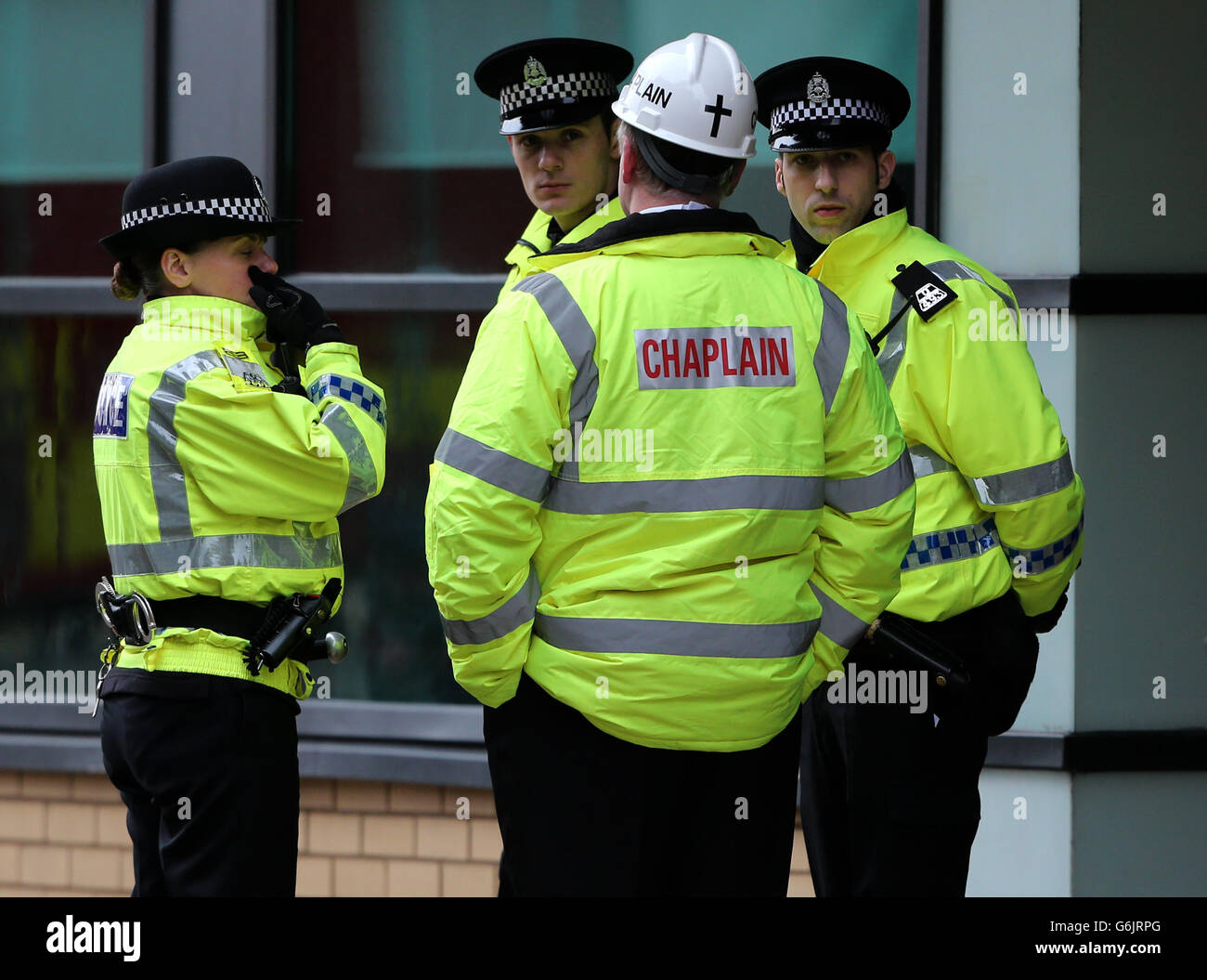 Chaplain speaking police officers close scene clutha bar helicopter ...