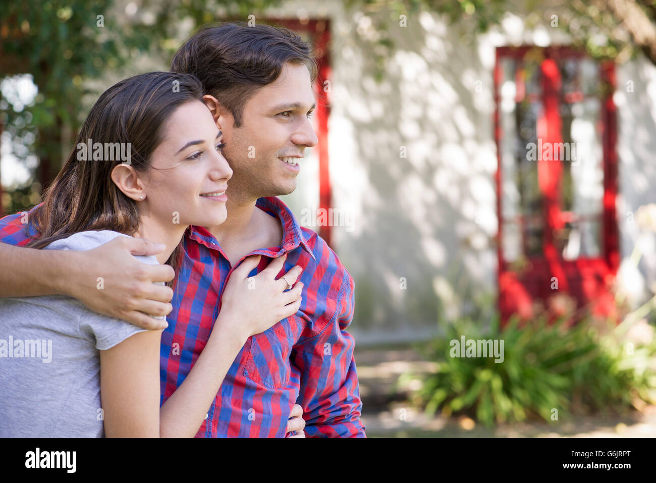 Couple looking forward to glowing future together Stock Photo - Alamy