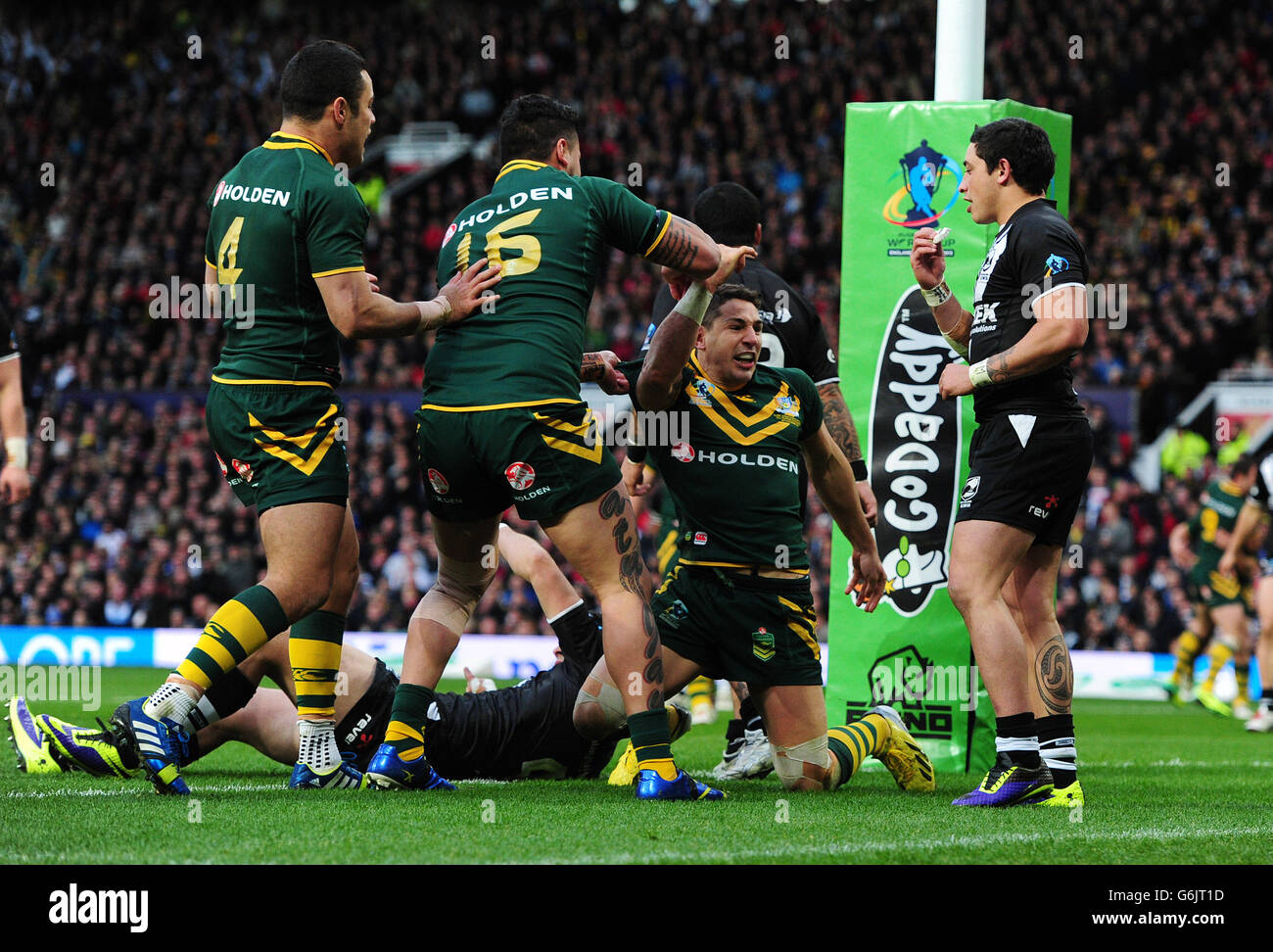 Australia's Billy Slater is congratulated by his team-mates after ...