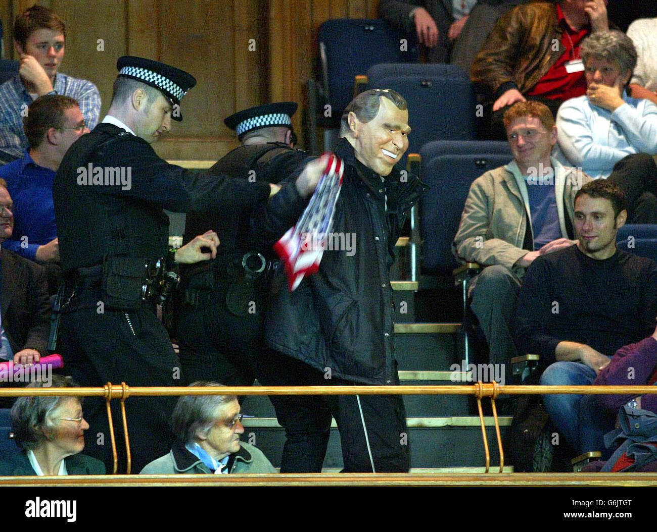 Wearing a george bush mask hi-res stock photography and images - Alamy