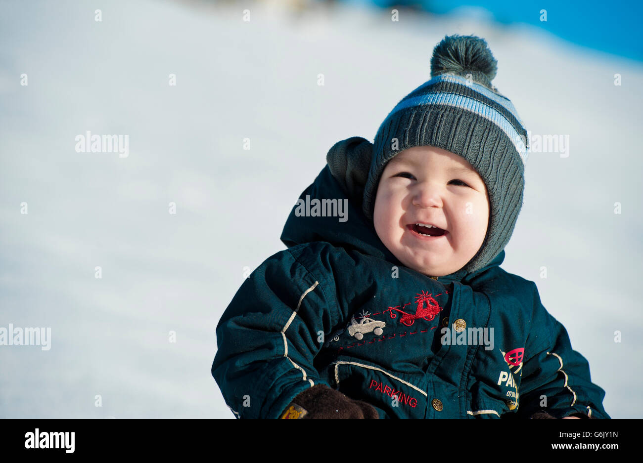 Happy little boy in snow Stock Photo - Alamy