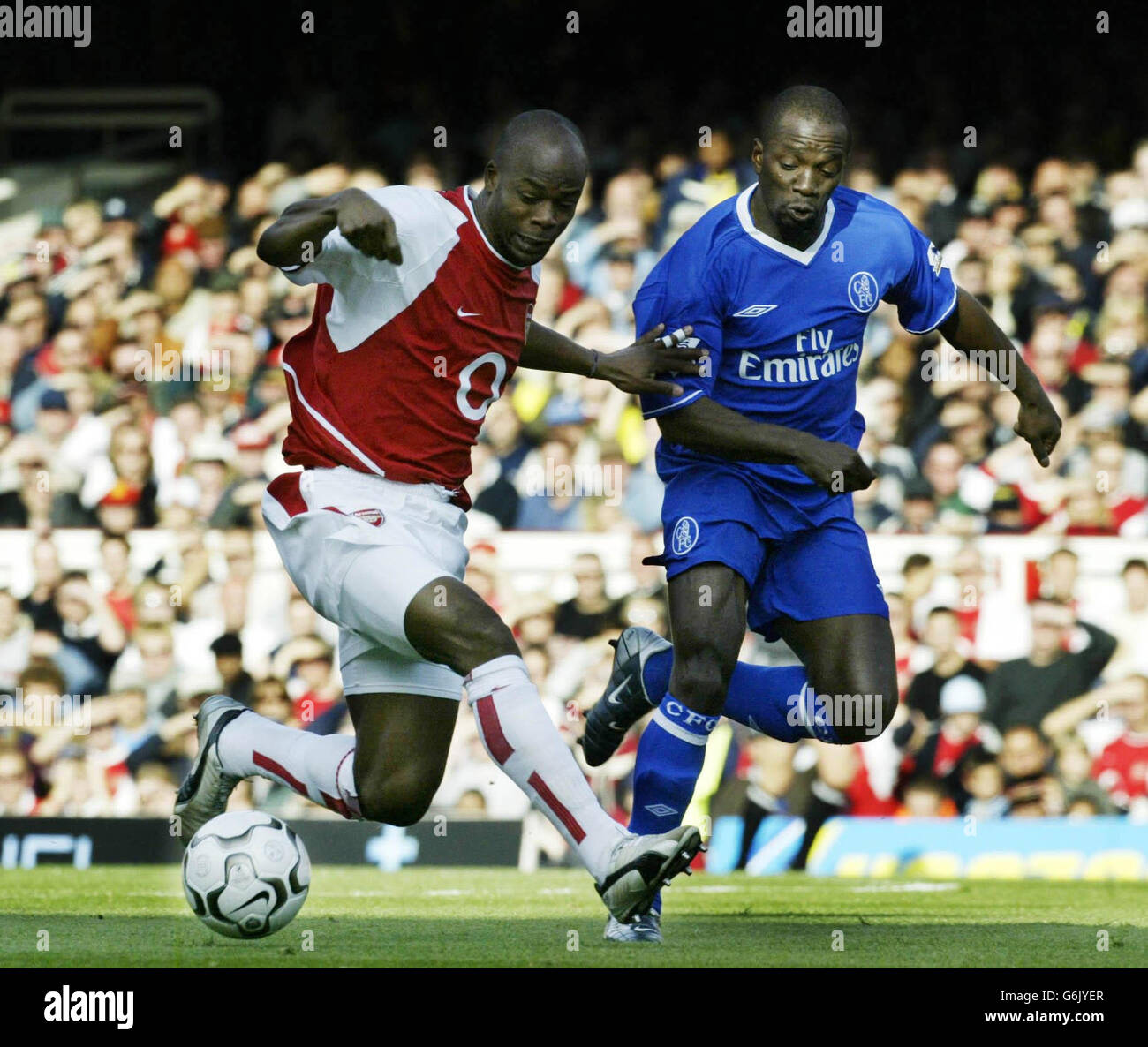 Arsenal's Sylvain Wiltord holds off Chelsea's Claude Makelele (R ...