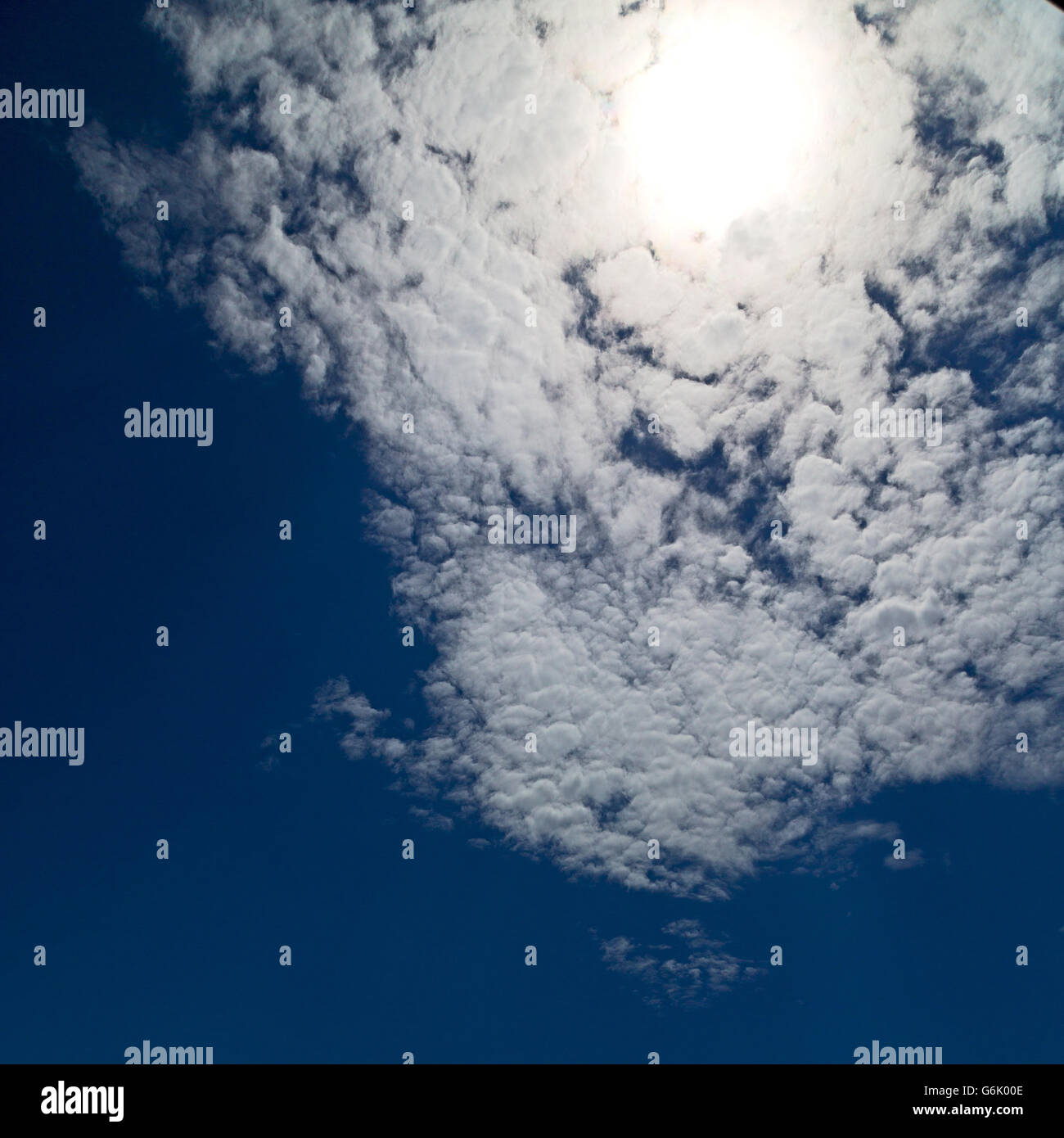 in the cyclades sea of greece sun light and backlight from the clouds ...