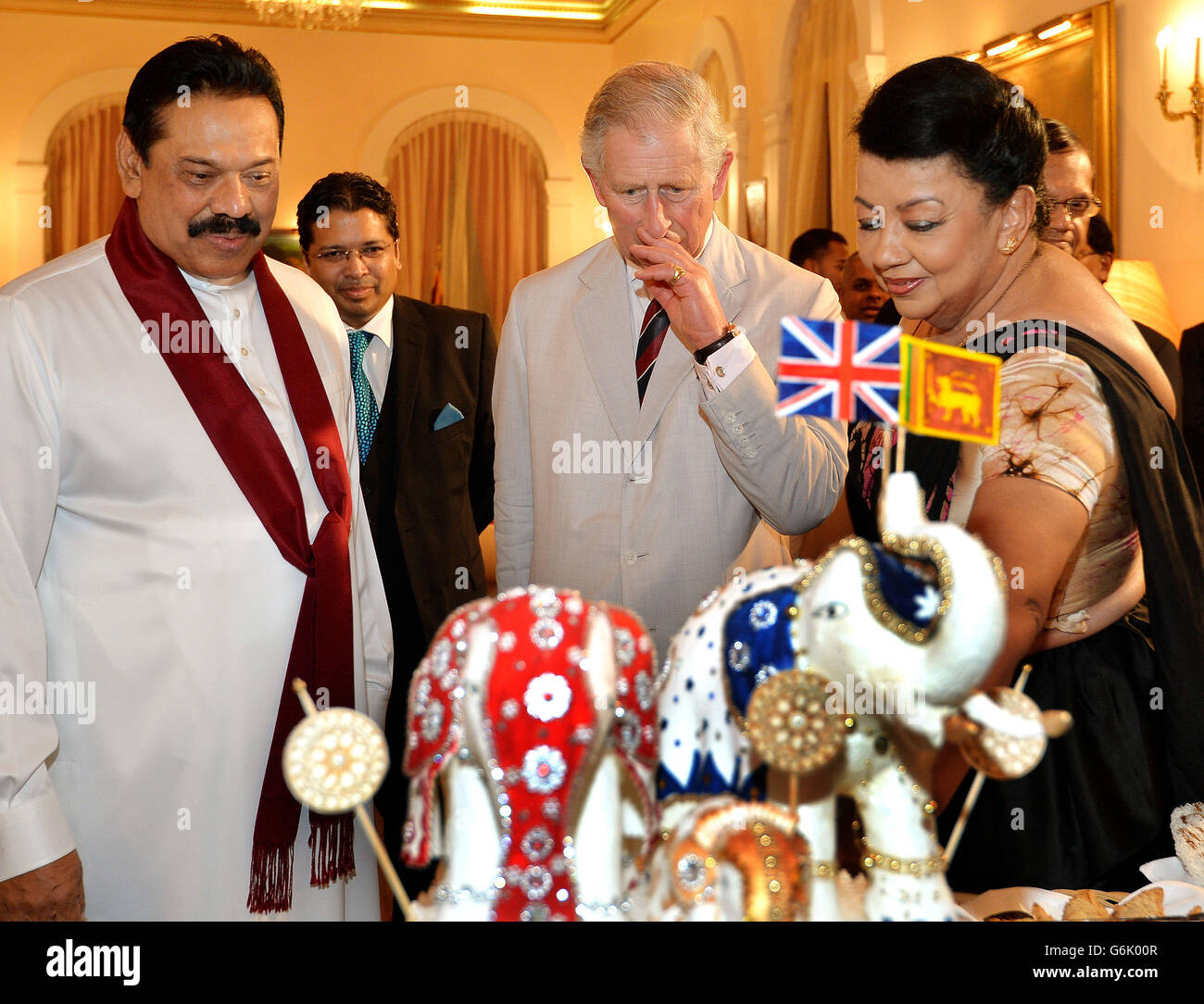 The prince wales presented birthday cake topped by three elephants hi ...