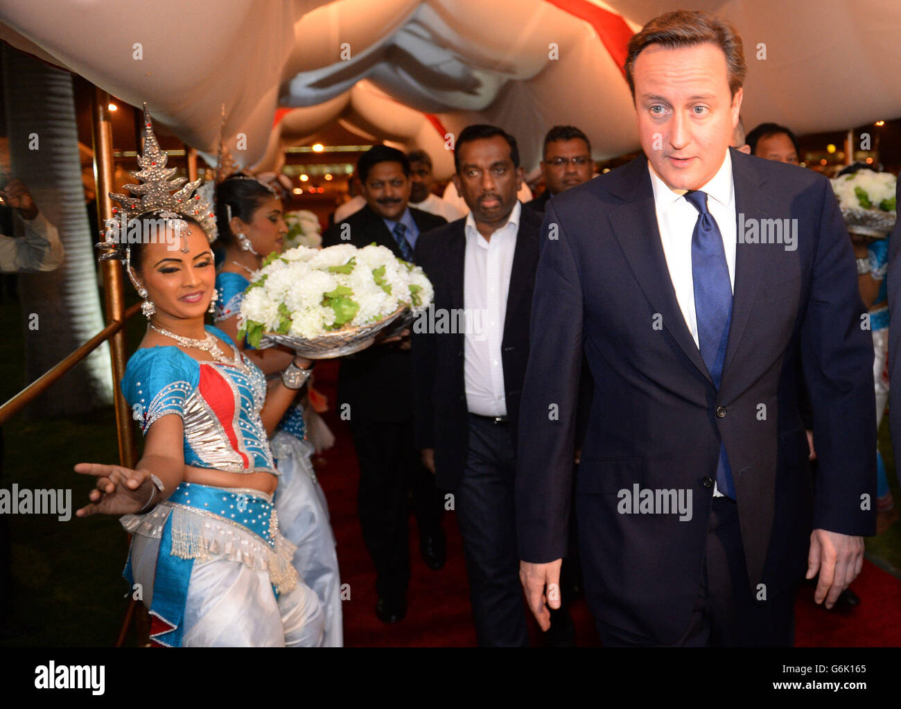 Prime Minister David Cameron is welcomed by traditional Sri Lankan ...