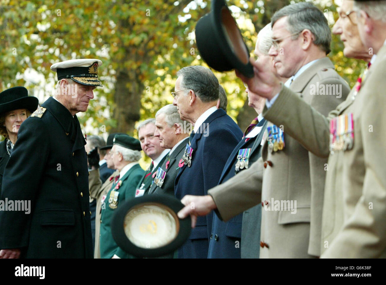 Hats are removed as the Duke of Edinburgh (left) inspects the Field of ...