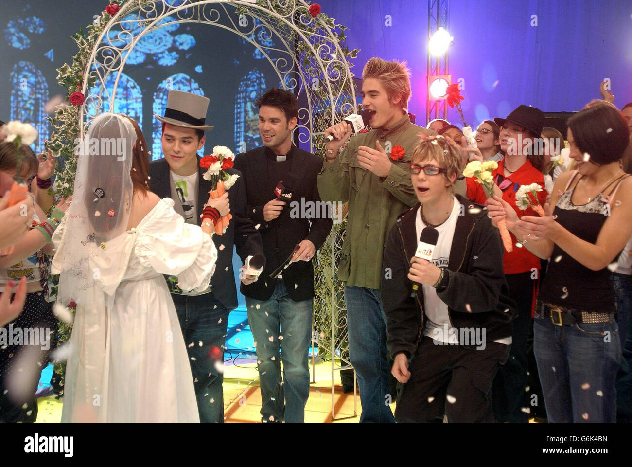 MTV presenter Dave Berry (centre) plays vicar during a make-believe ...