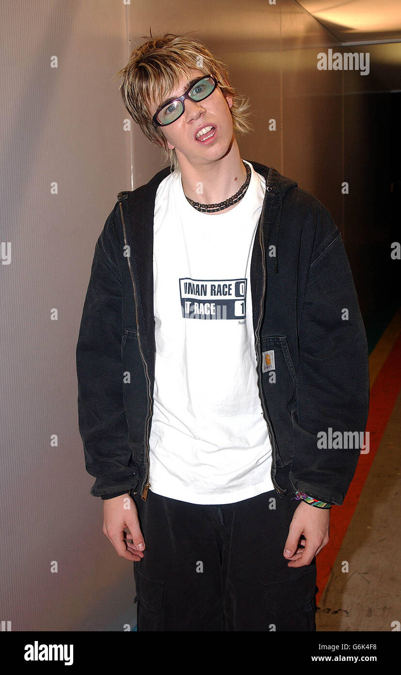 Celebrity music on stage 1 2 half length pulling face hi-res stock ...