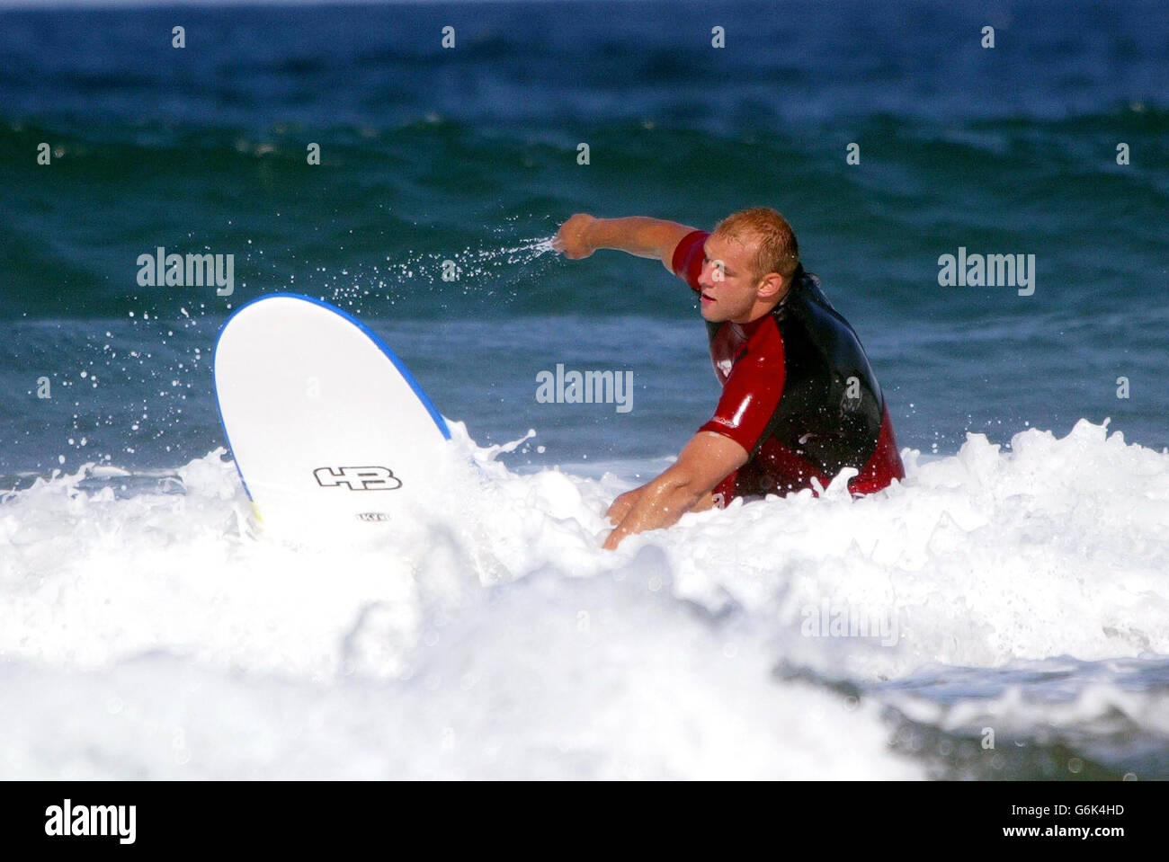 Ben Kay comes off his surfboard Stock Photo - Alamy