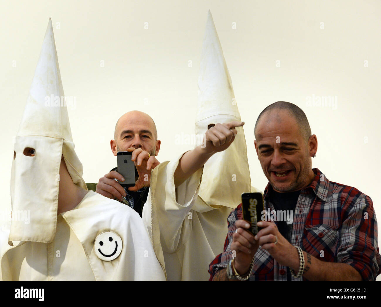 Artists Jake (left) and Dinos Chapman pose with one of their exhibits ...