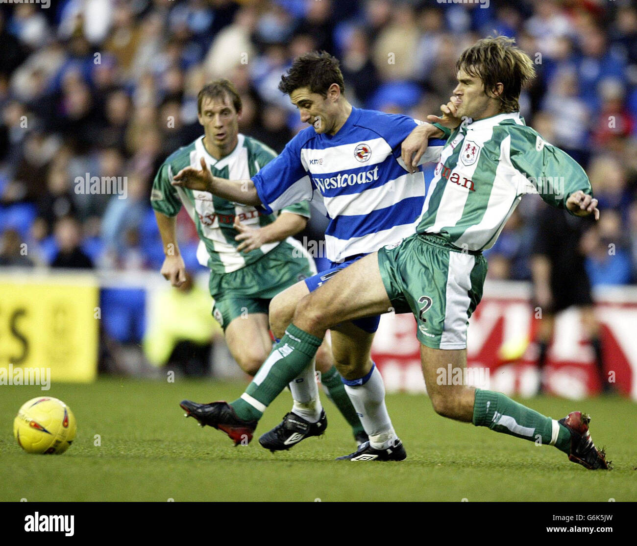 Reading's Nicky Forster (centre) tussles with Millwall defender Matt ...