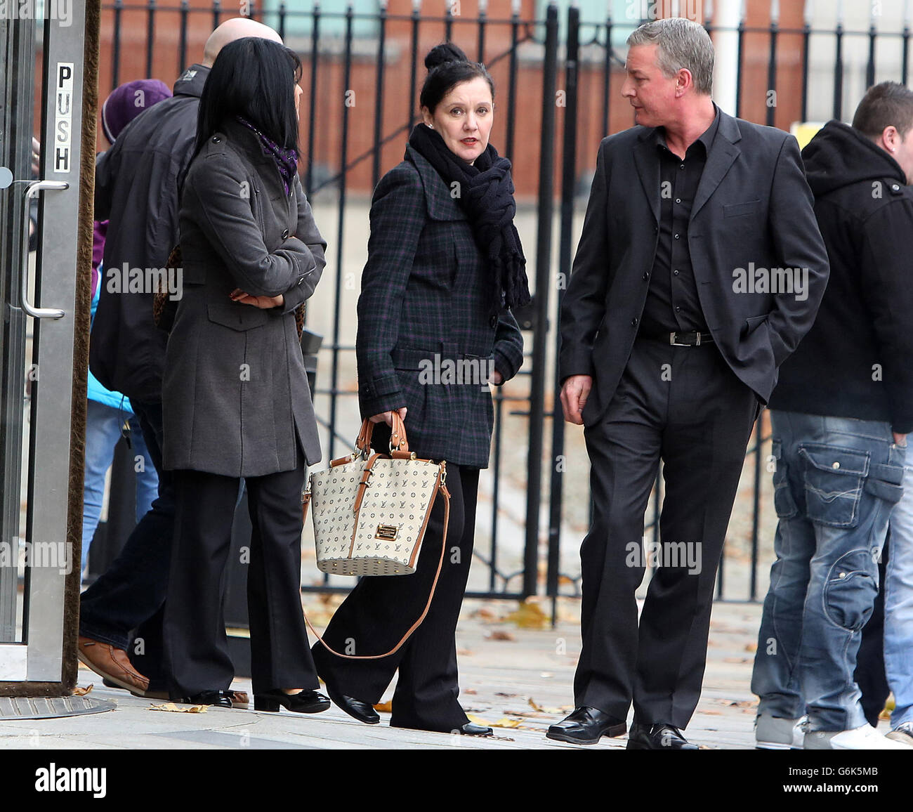 Aine Dahlstrom, (centre) daughter of Liam Adams leaves Laganside court ...