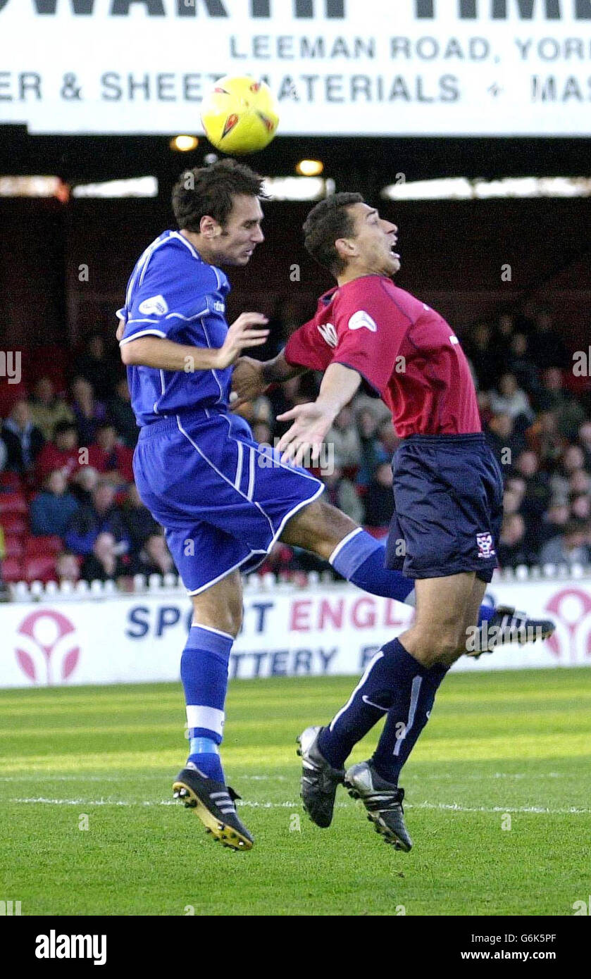 York's Lee Nogan (right) goes for the header with Steve Foster of ...