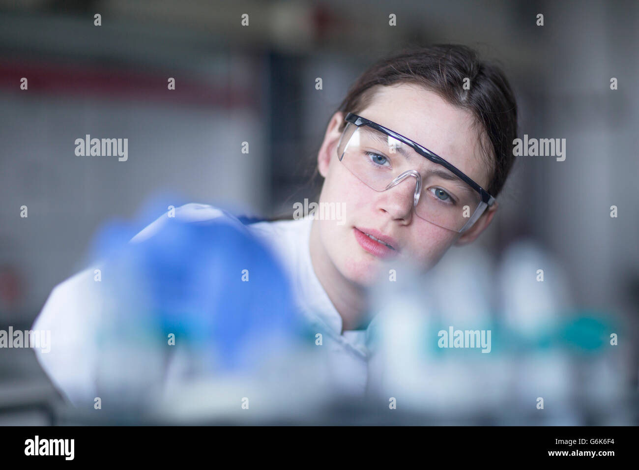 Lab technician examining sample Stock Photo - Alamy