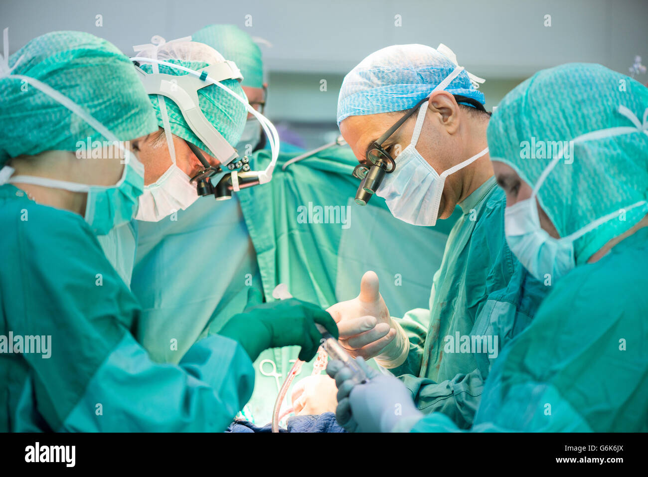 Heart surgeons during a heart operation Stock Photo - Alamy