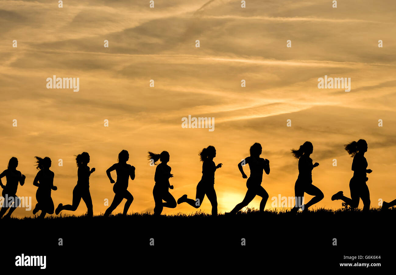 Silhouette of female jogger at sunset, sequence, phases Stock Photo - Alamy