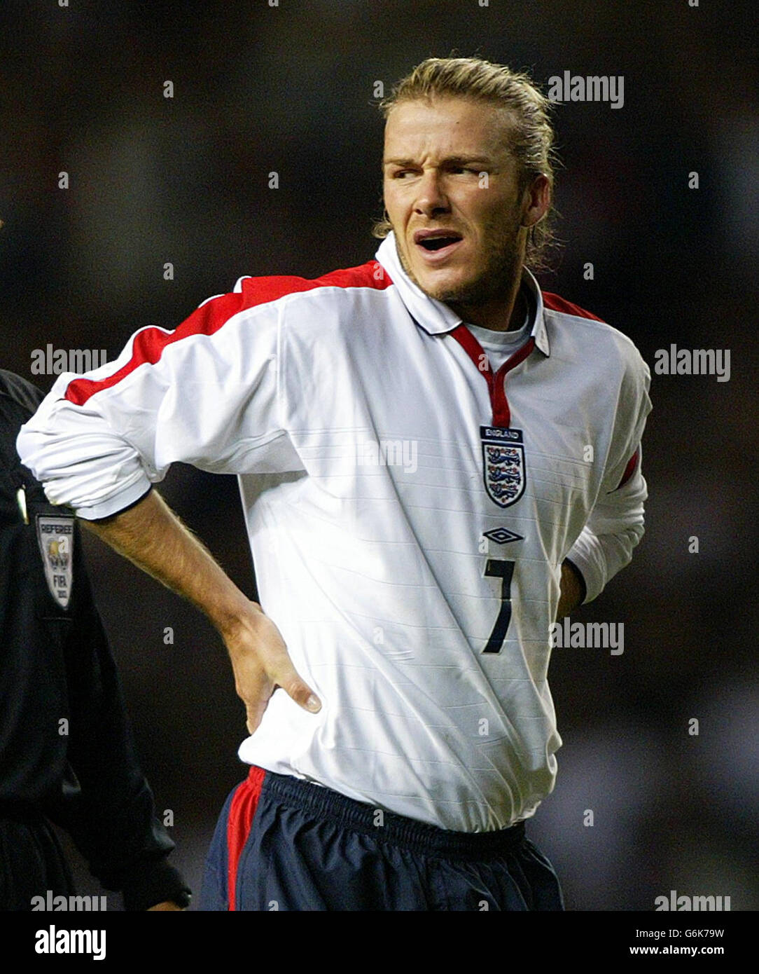 England's David Beckham holds his injured back during the international ...