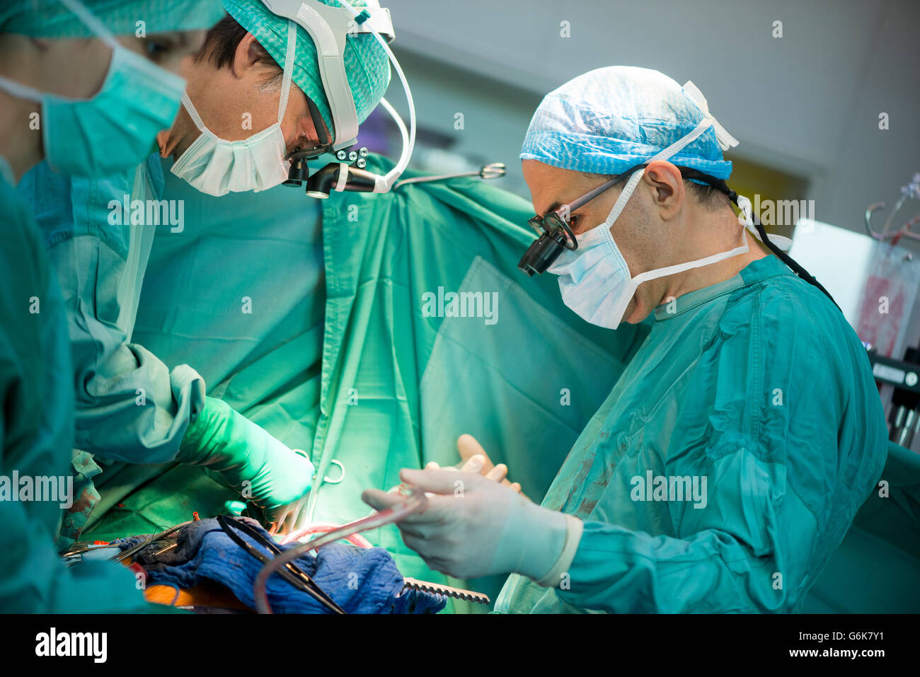 Heart surgeons during heart operation hi-res stock photography and ...