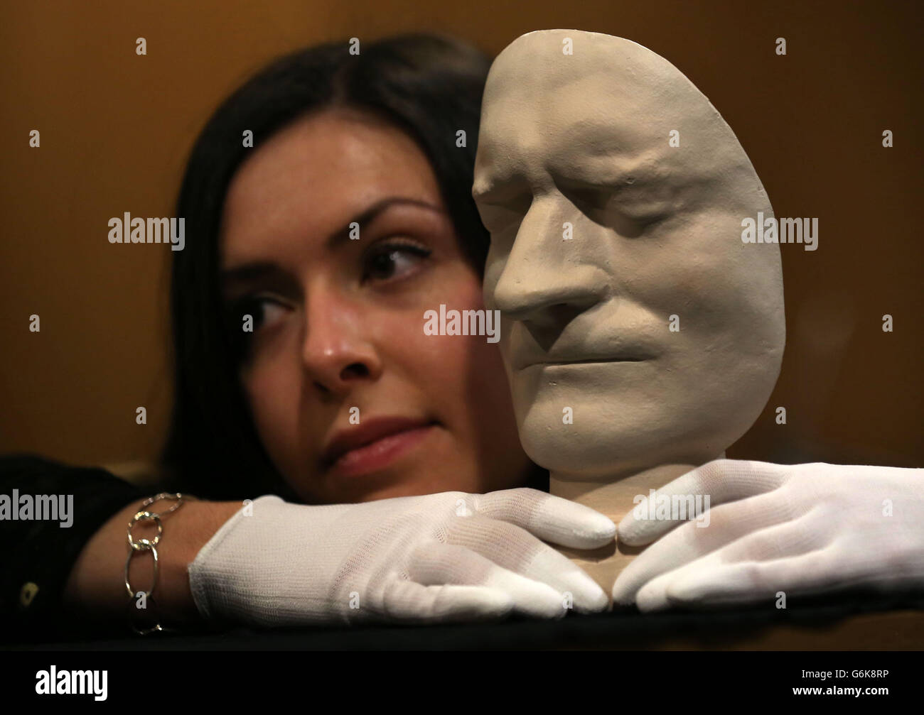 Sir Isaac Newton's death mask held by staff member Emma Smith is part ...