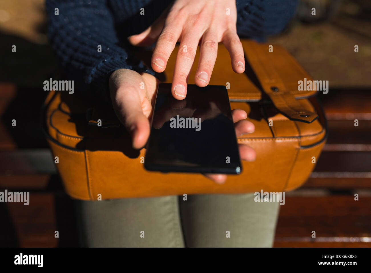 Woman's hand touching display of smartphone Stock Photo - Alamy