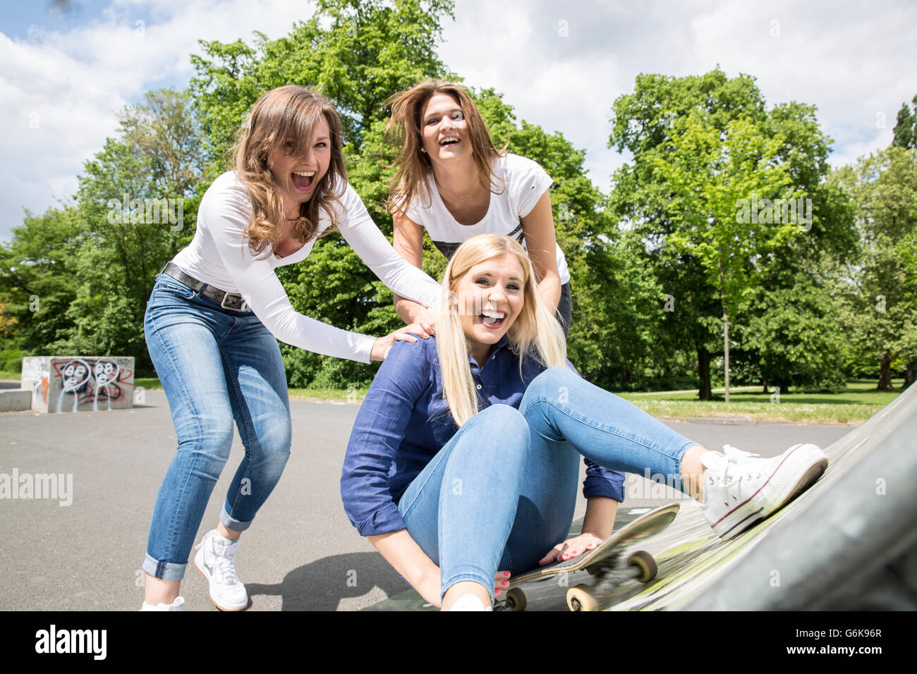 Three young woman having fun together Stock Photo - Alamy