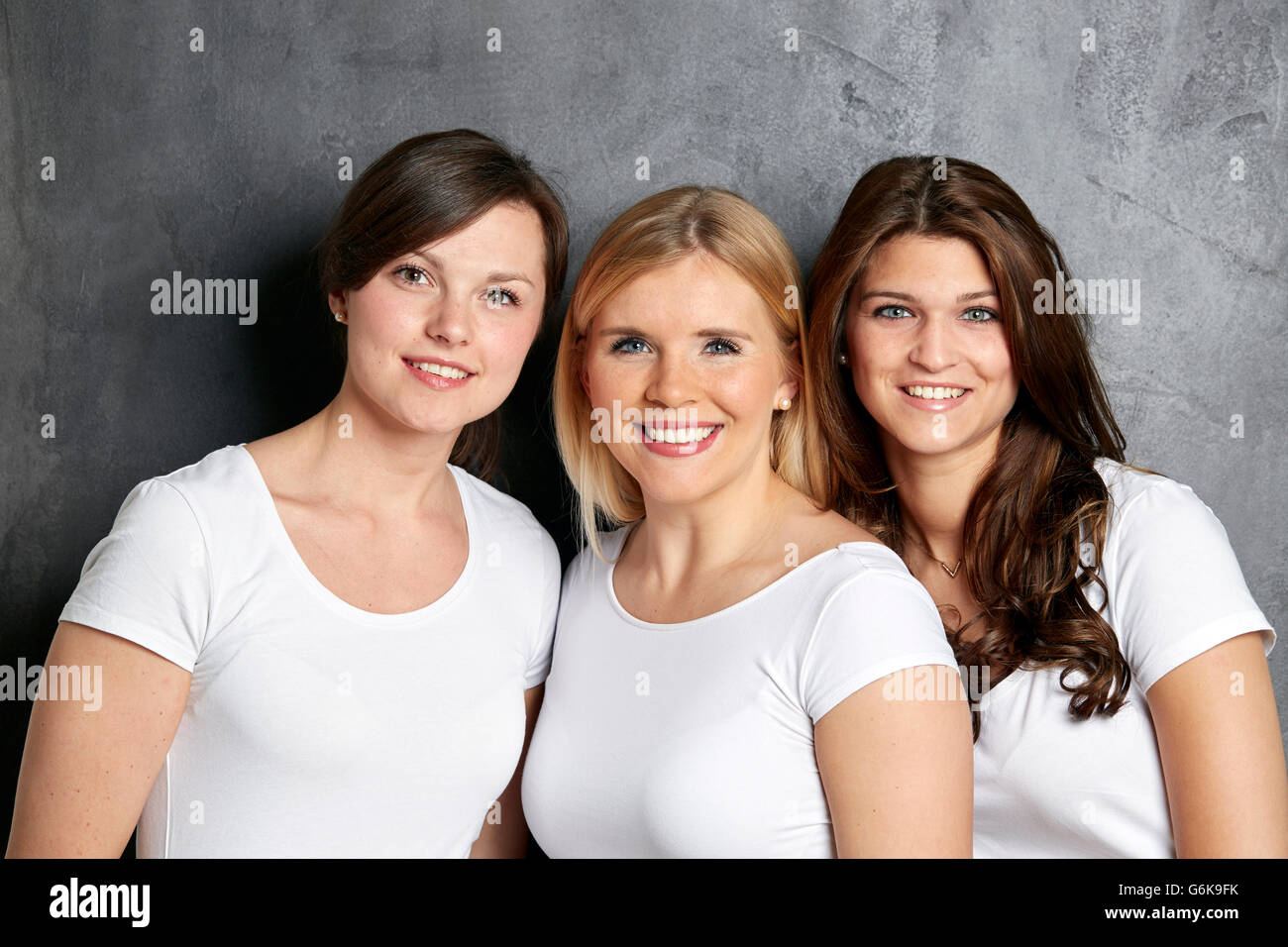 Group picture of three smiling friends Stock Photo - Alamy