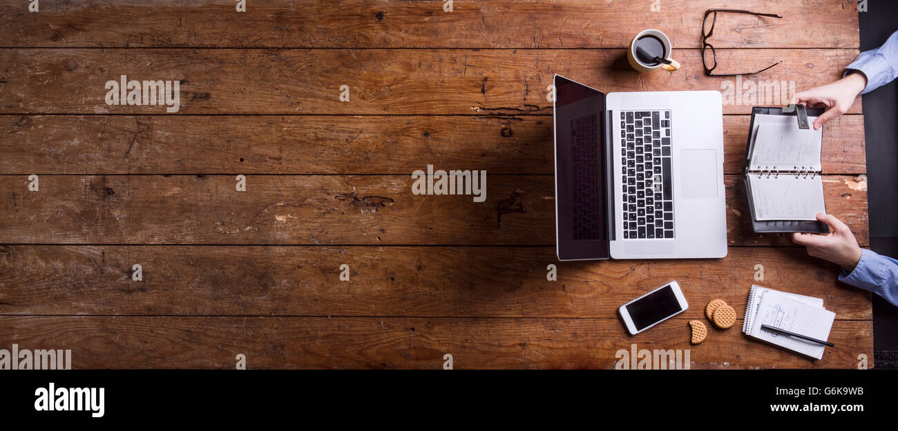 Man working on desk, calendar Stock Photo - Alamy