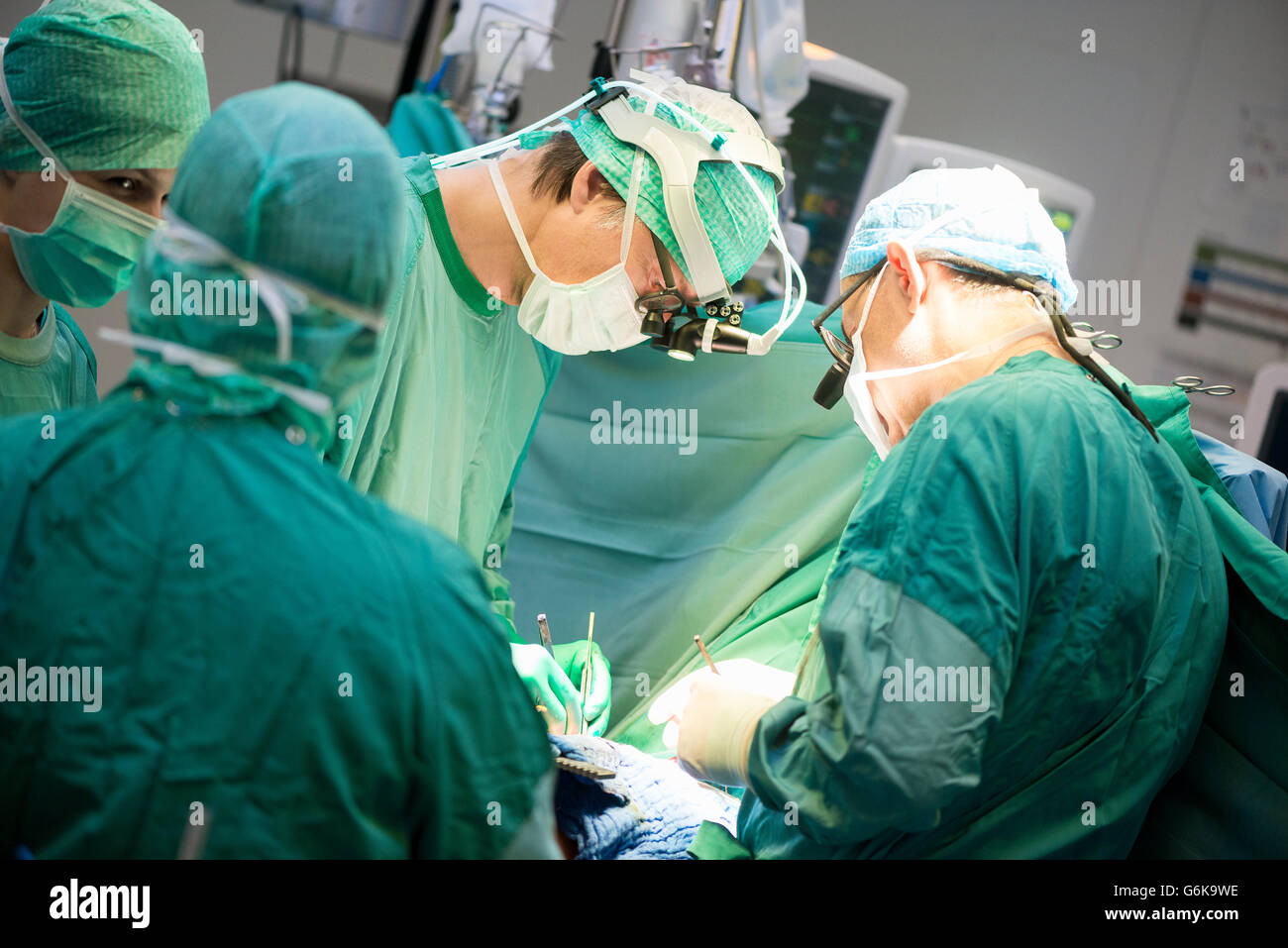 Heart surgeons during a heart operation Stock Photo - Alamy