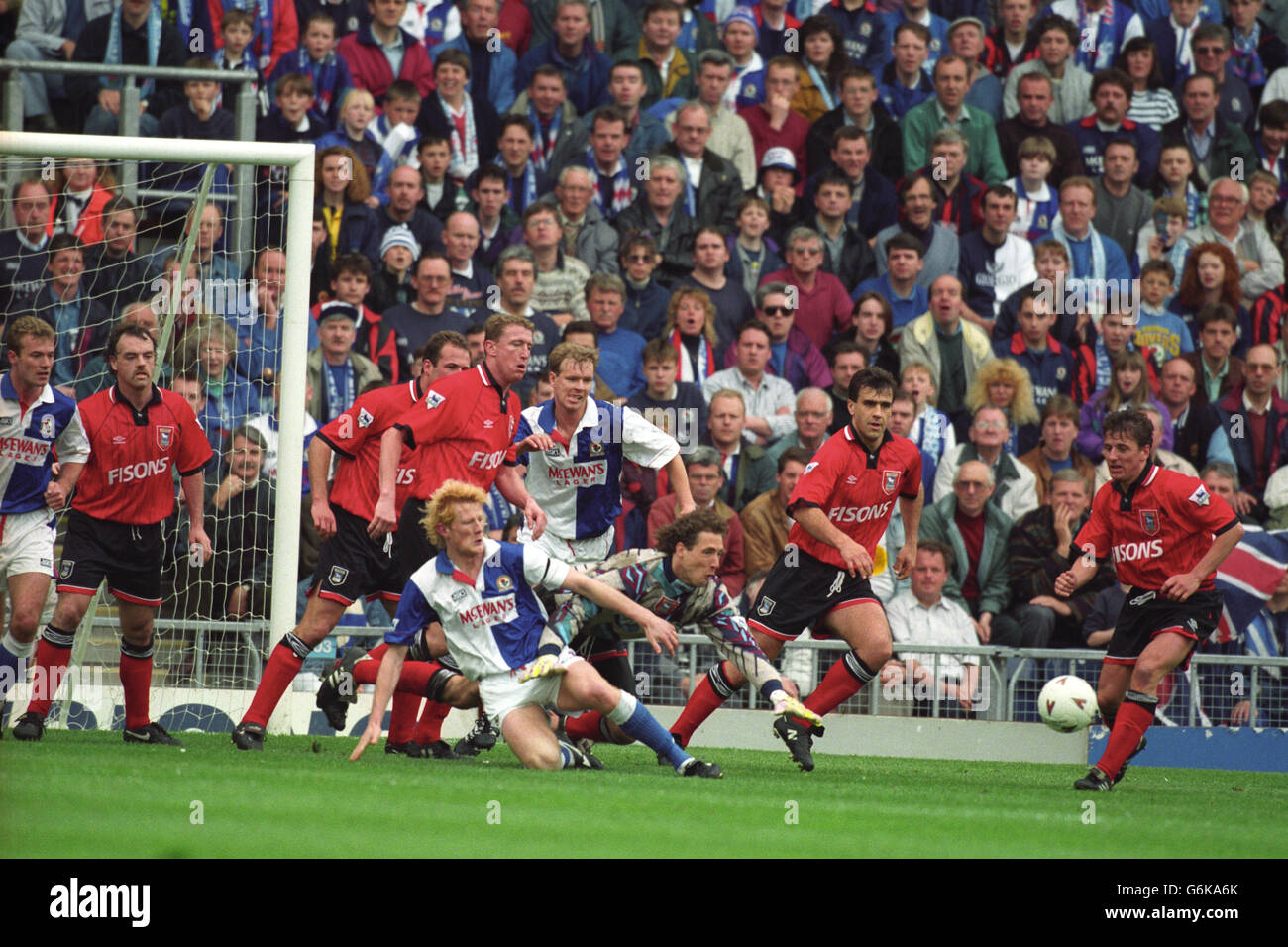Ipswich Town goalkeeper Craig Forrest tries to clear the goal area ...