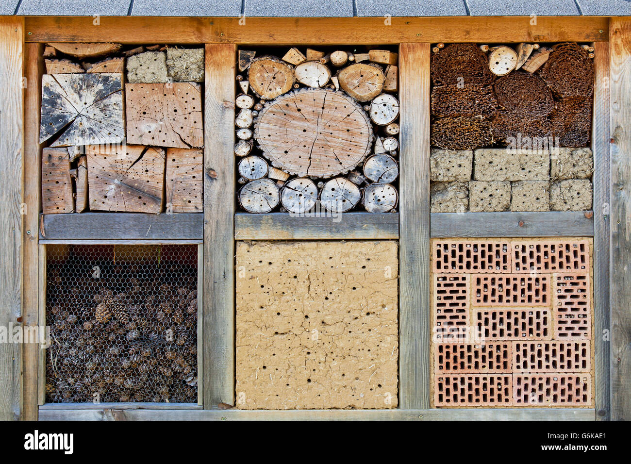 Insect hotel with bricks, wood and pine cones Stock Photo - Alamy