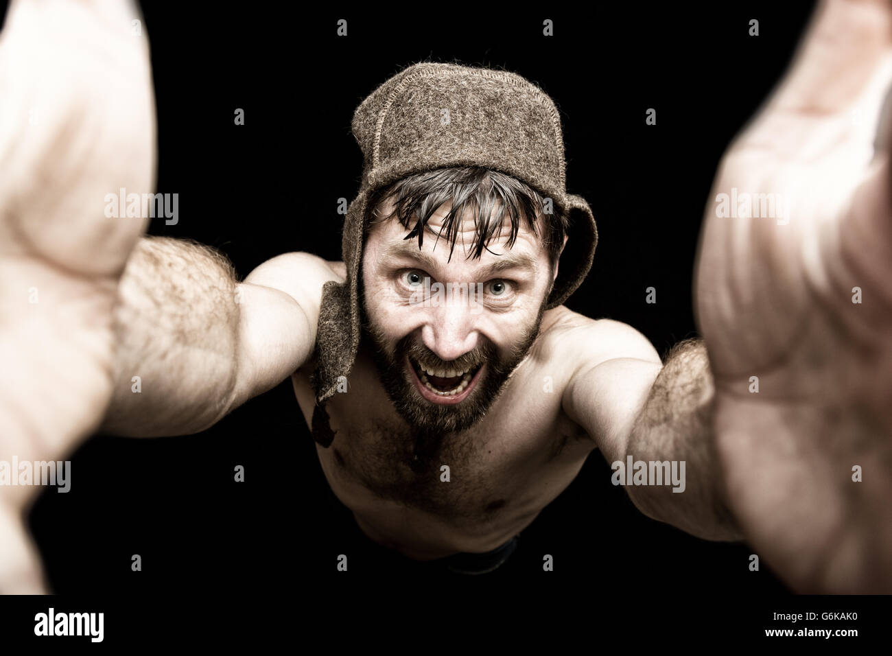 Dark portrait of scary evil sinister bearded man with smirk, makes ...