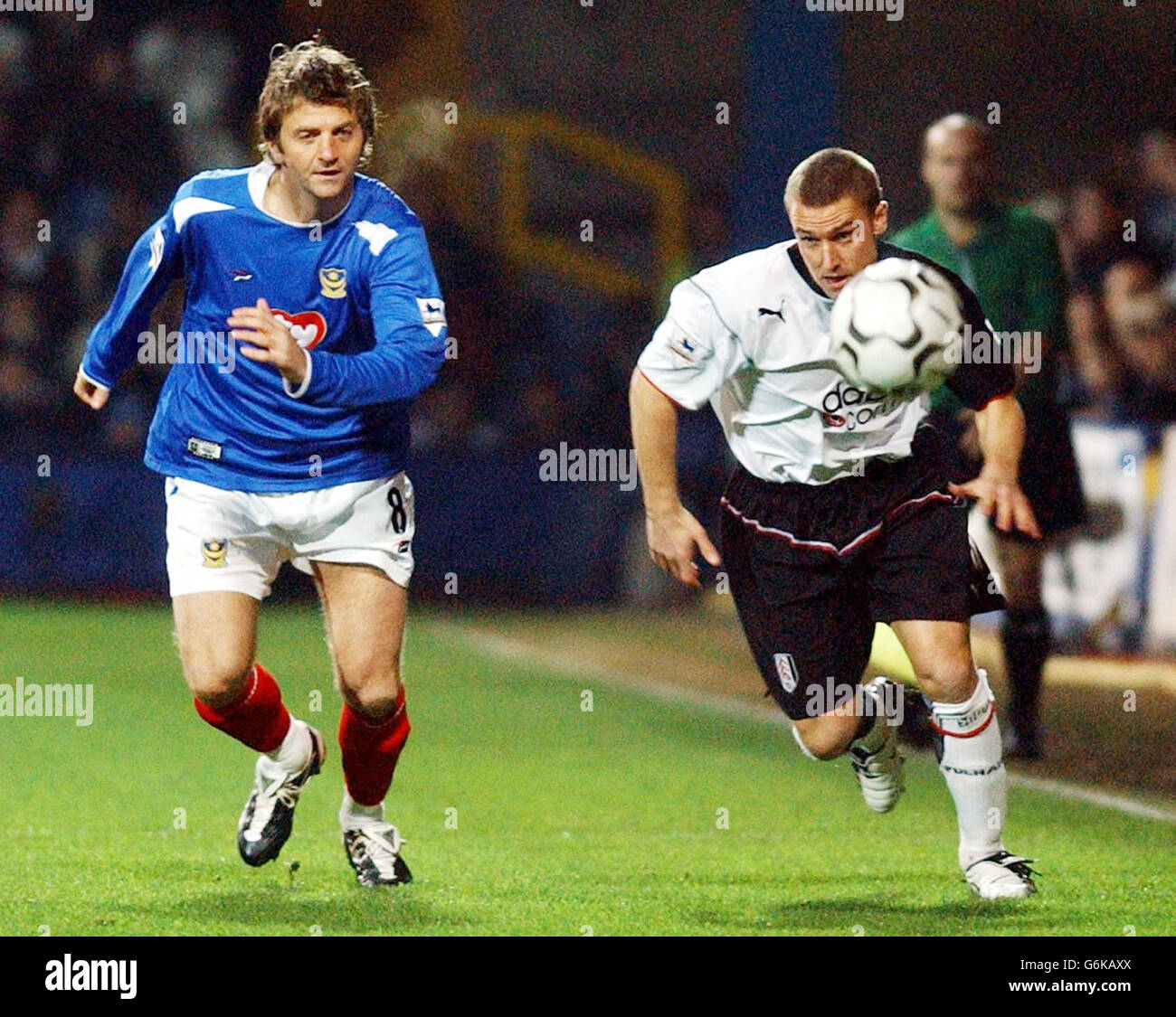 Portsmouth's Tim Sherwood (left) and Fulham's Lee Clark in action ...