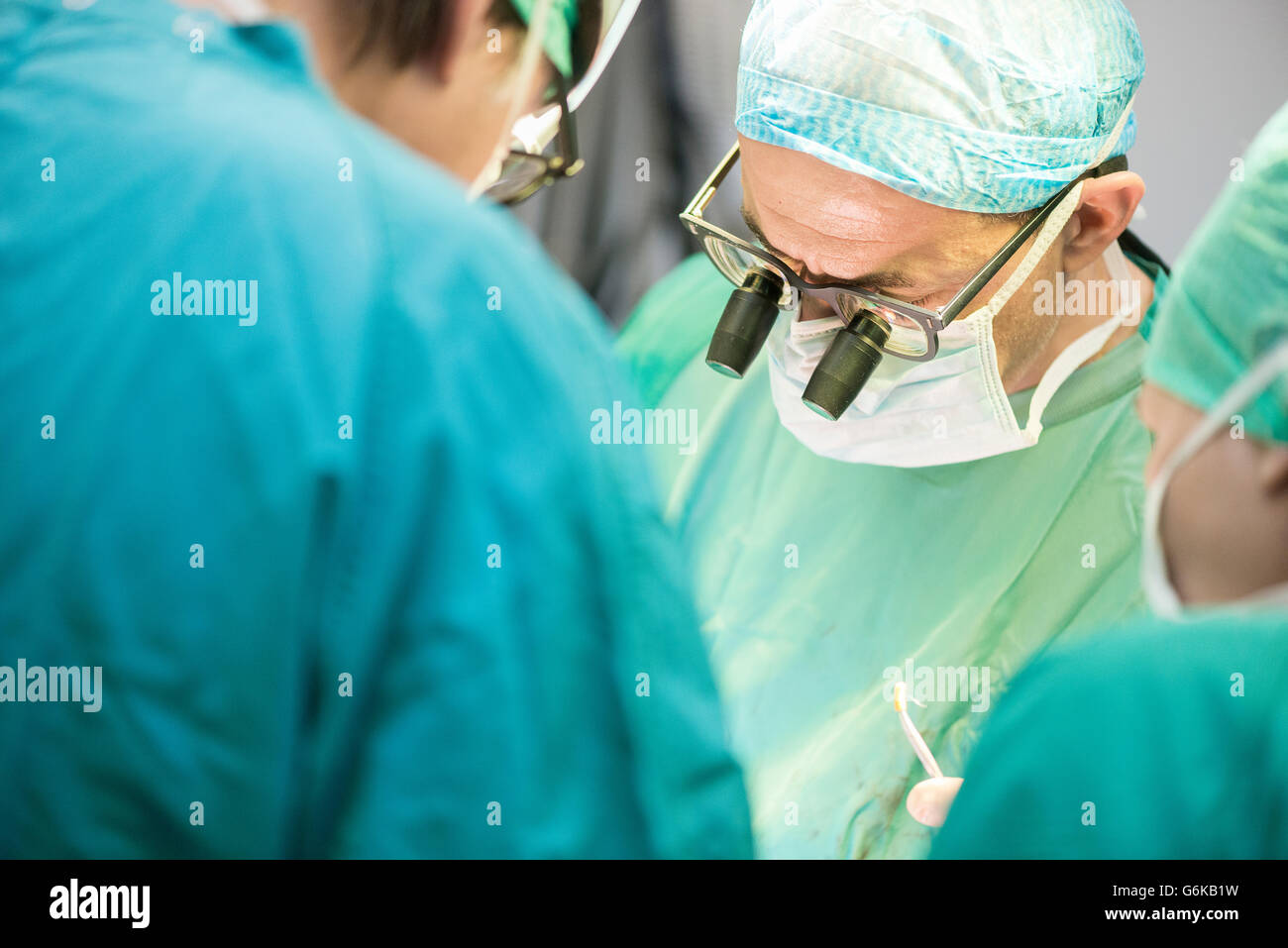 Heart surgeons during a heart operation Stock Photo - Alamy