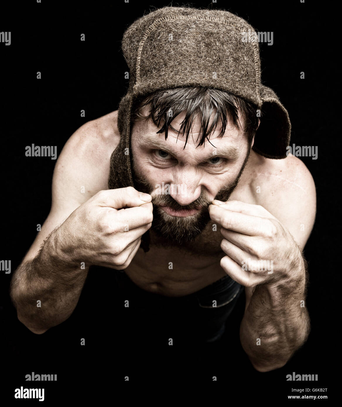 Dark portrait of scary evil sinister bearded man with smirk, makes ...