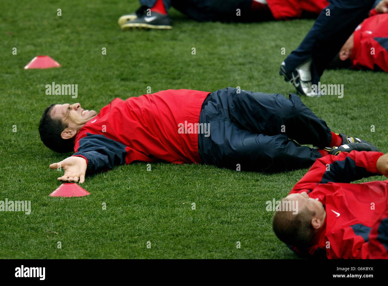 England captain Martin Johnson stretches during their training session ...