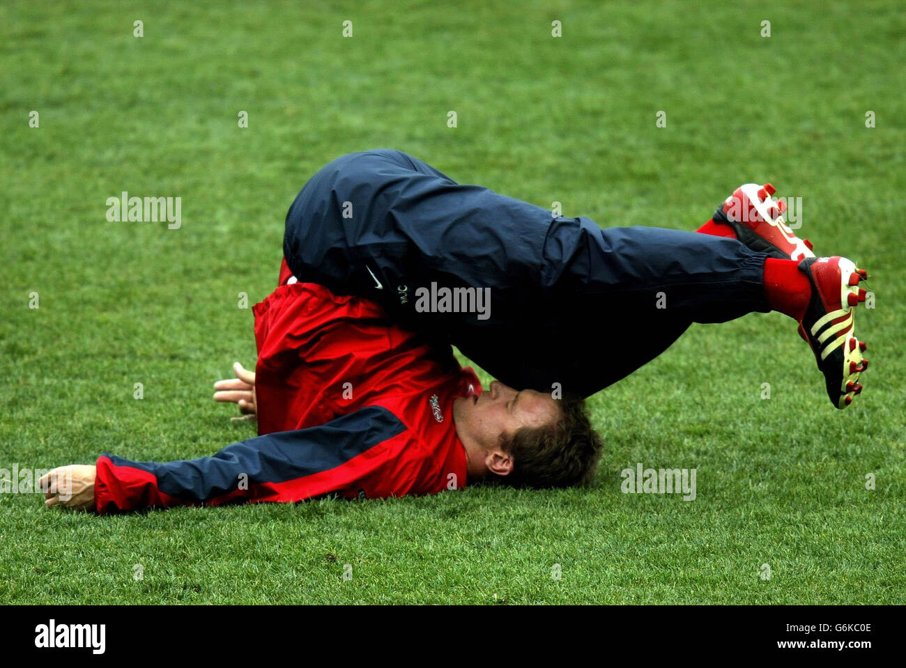 England's Mike Catt stretches during training at the Telstra Stadium ...