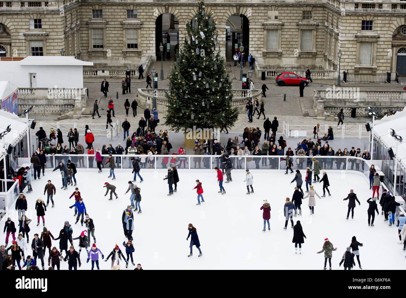 Skaters on the winter ice rink at Somerset House, London, as they wear ...
