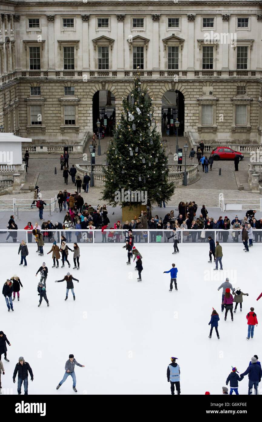 Skaters on the winter ice rink at Somerset House, London, as they wear ...