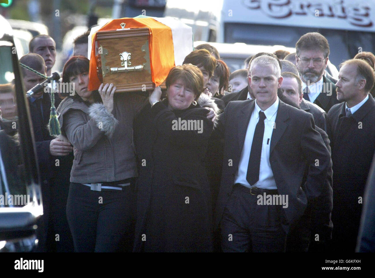Sinn Fein President Gerry Adams (second right) follows the procession ...