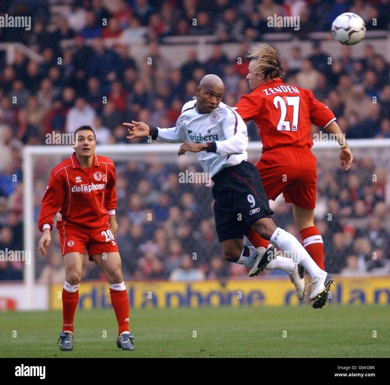 Middlesbrough's Zenden loses an aerial challenge to Liverpool's Hadji ...