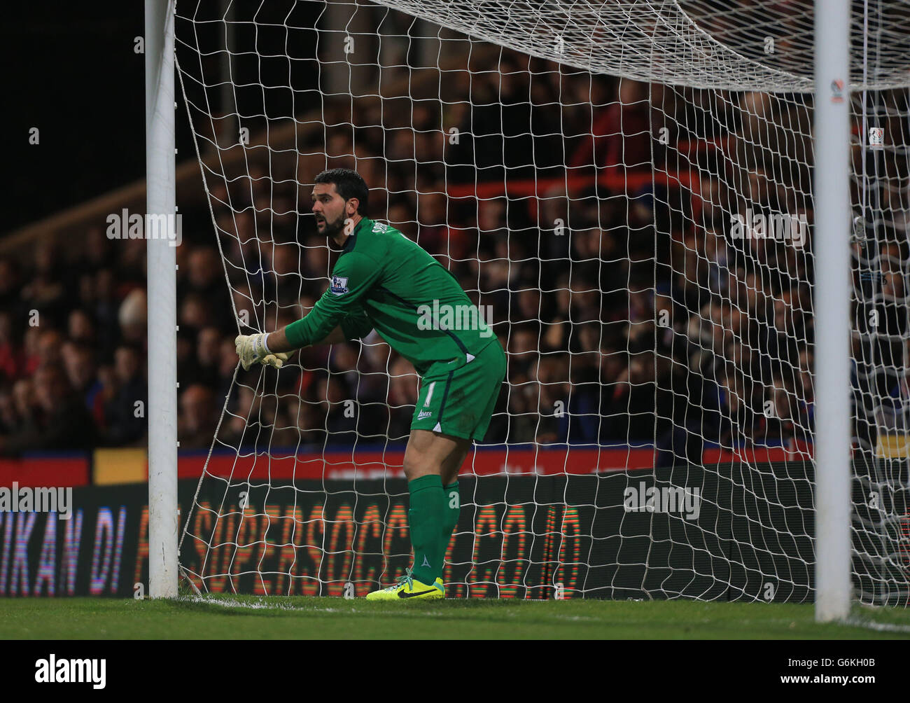 Crystal Palace goalkeeper Julián Speroni shows the referee the side ...