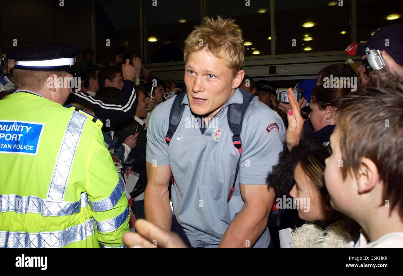 England rugby player Josh Lewsey is escorted through the crowd at ...