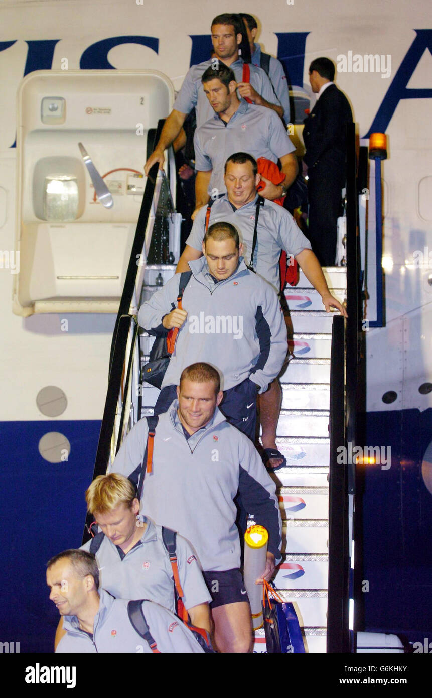 Members of the England rugby squad emerge from a British Airways Boeing ...